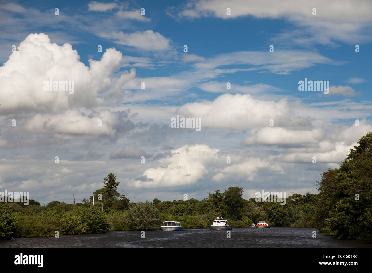River boats touring the Norfolk Broads on the River Bure Norfolk ...