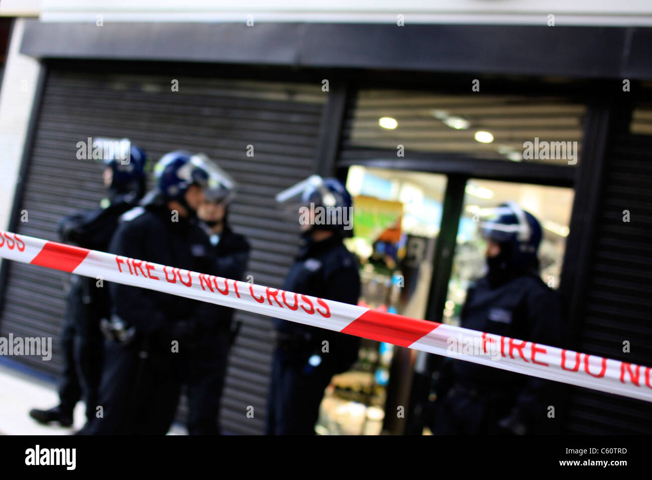 Police guarding JD Sports in Hackney during the riots in August 2011 ...