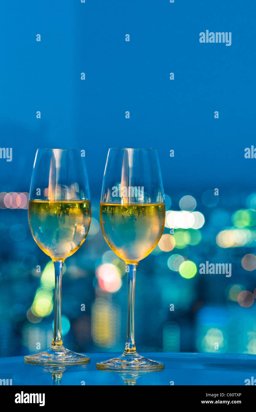 Champagne glasses in front of a window in the night sky Stock Photo - Alamy