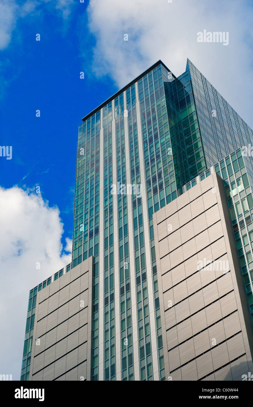 Skyscraper front view with blue sky Stock Photo - Alamy