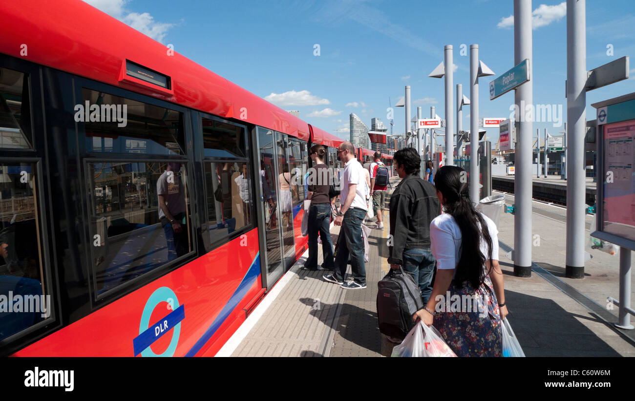 Passengers boarding a DLR Docklands Light Railway train carriage at ...