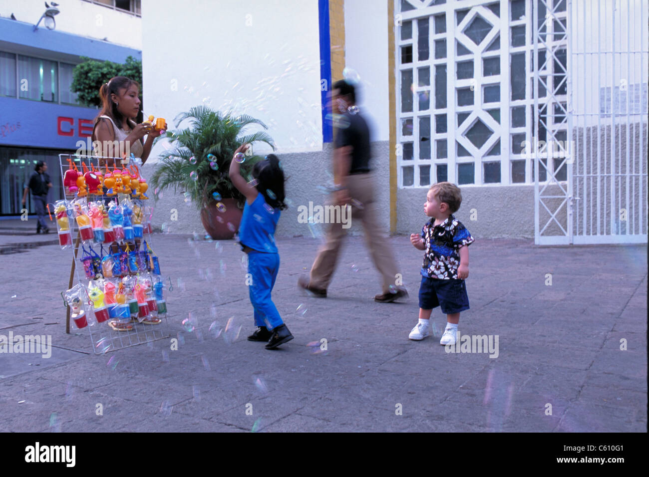 Kids playing with bubbles, Acapulco, Mexico Stock Photo - Alamy