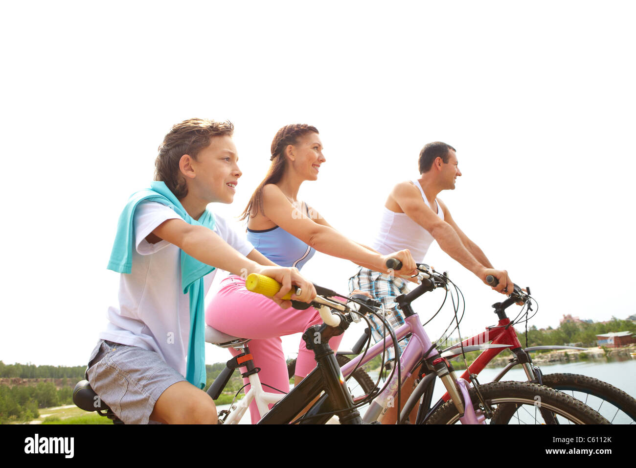 A family of three cycling together Stock Photo - Alamy