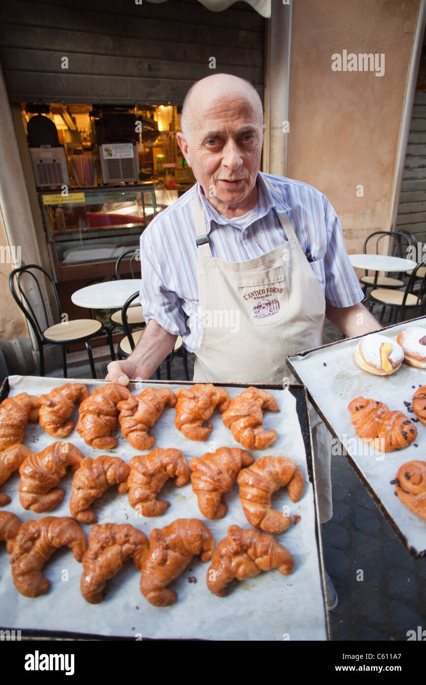 Italy, Rome, Baker Holding Trays of Pastries and Croissants Stock Photo ...