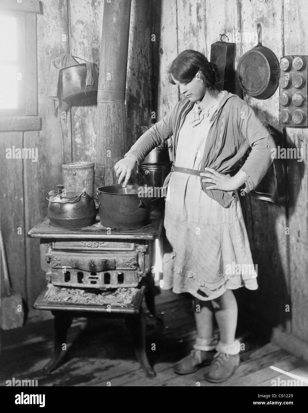 The teenage daughter of a an impoverished Arkansas farmer cooking on an ...