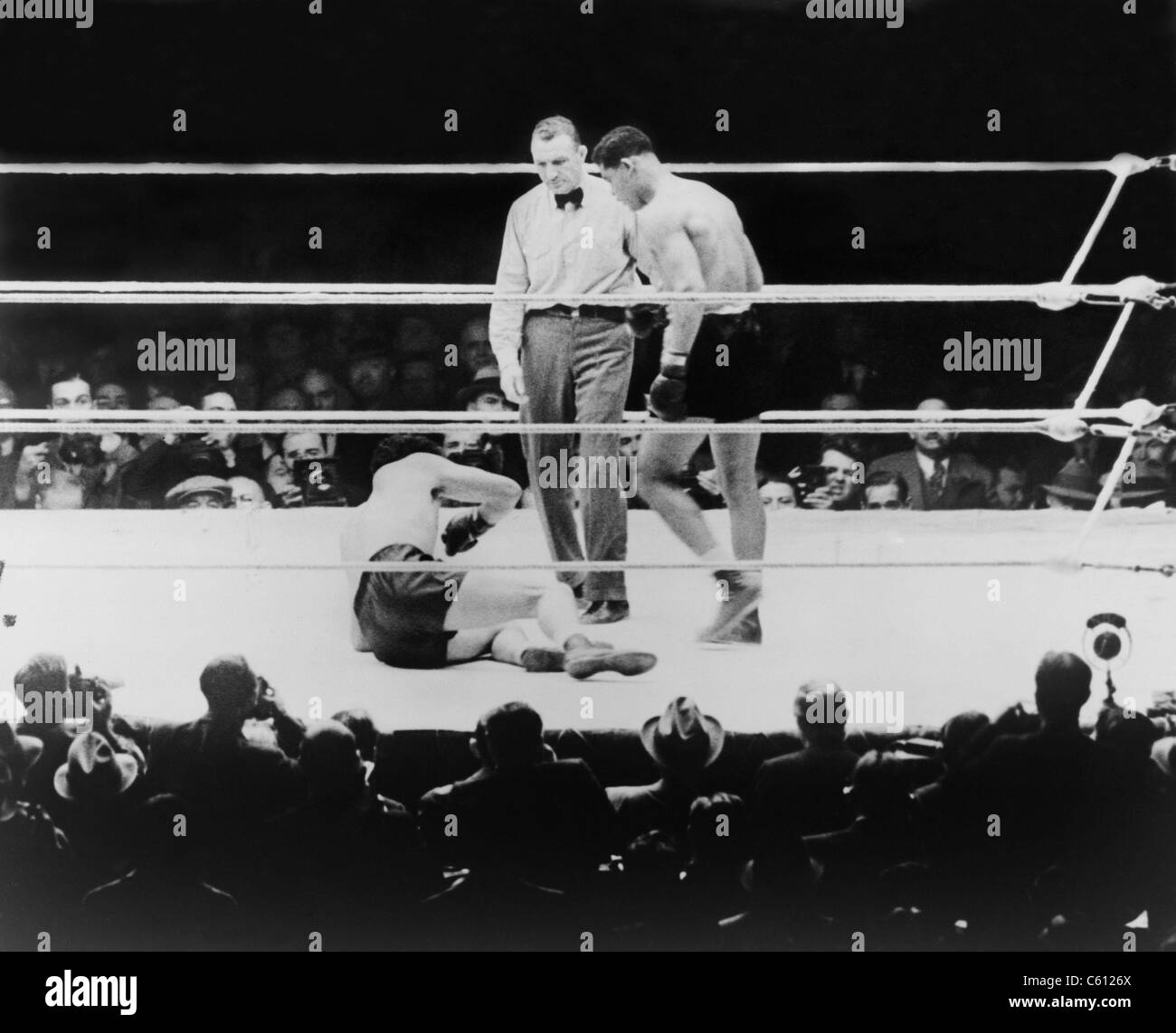 Max Baer (1909-1959), knocked down during a heavyweight fight with Joe ...