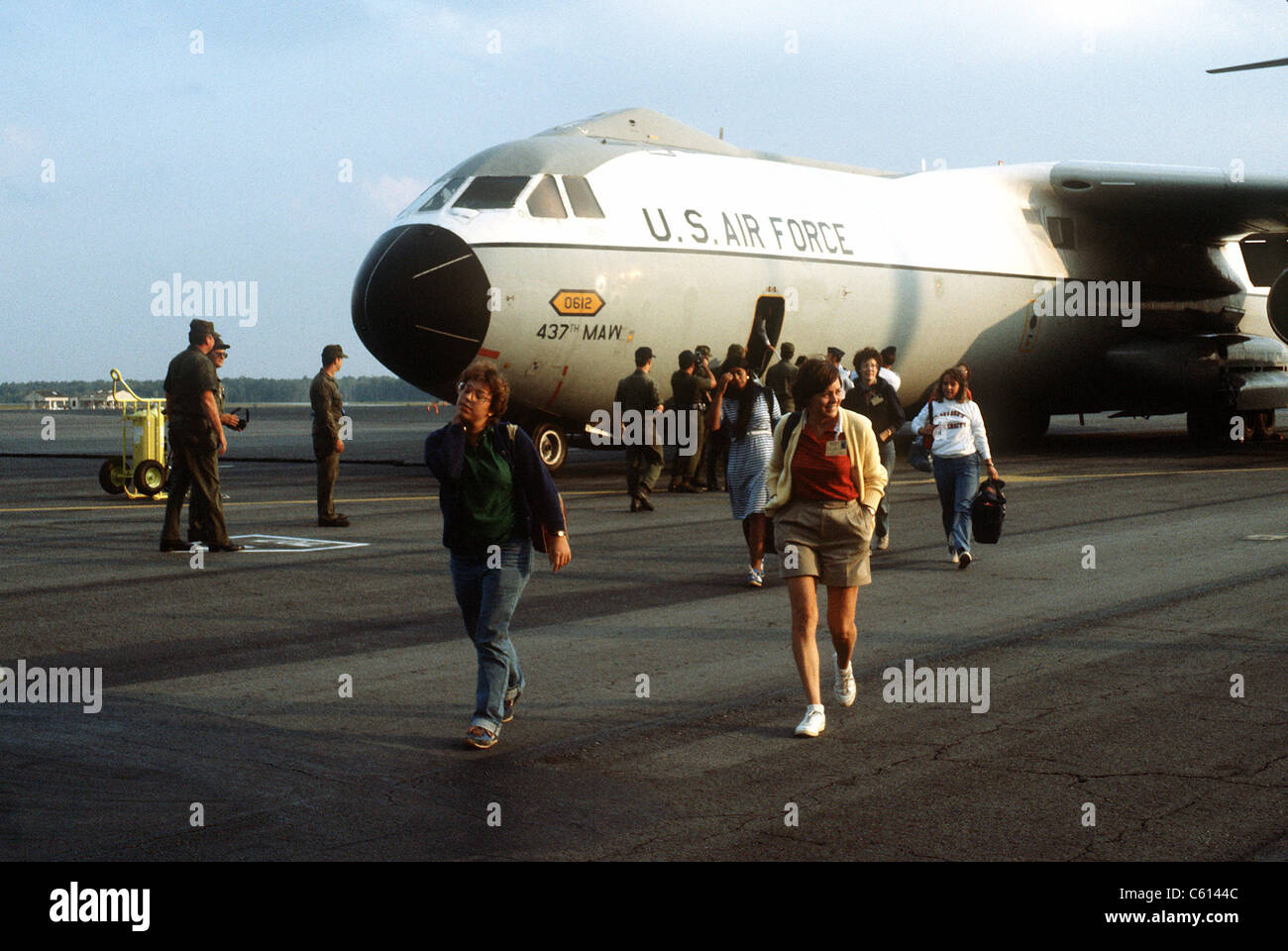 Women American medical students exit a U.S. Air Force transport from ...