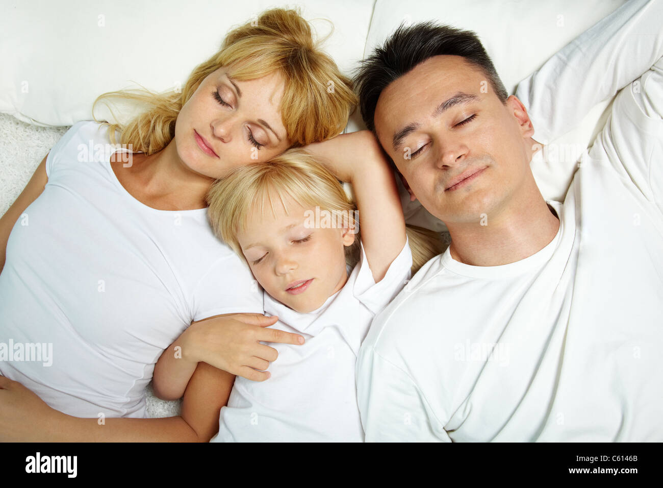 Portrait of calm family sleeping Stock Photo - Alamy