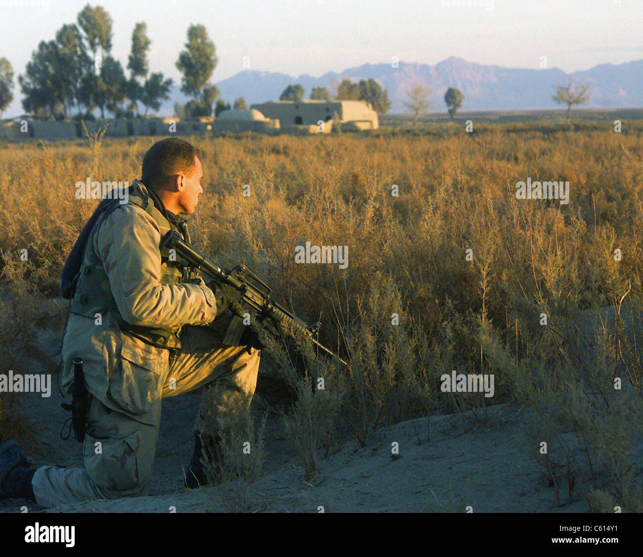 Marine Scout armed with M4 Carbine rifle provides security at a ...