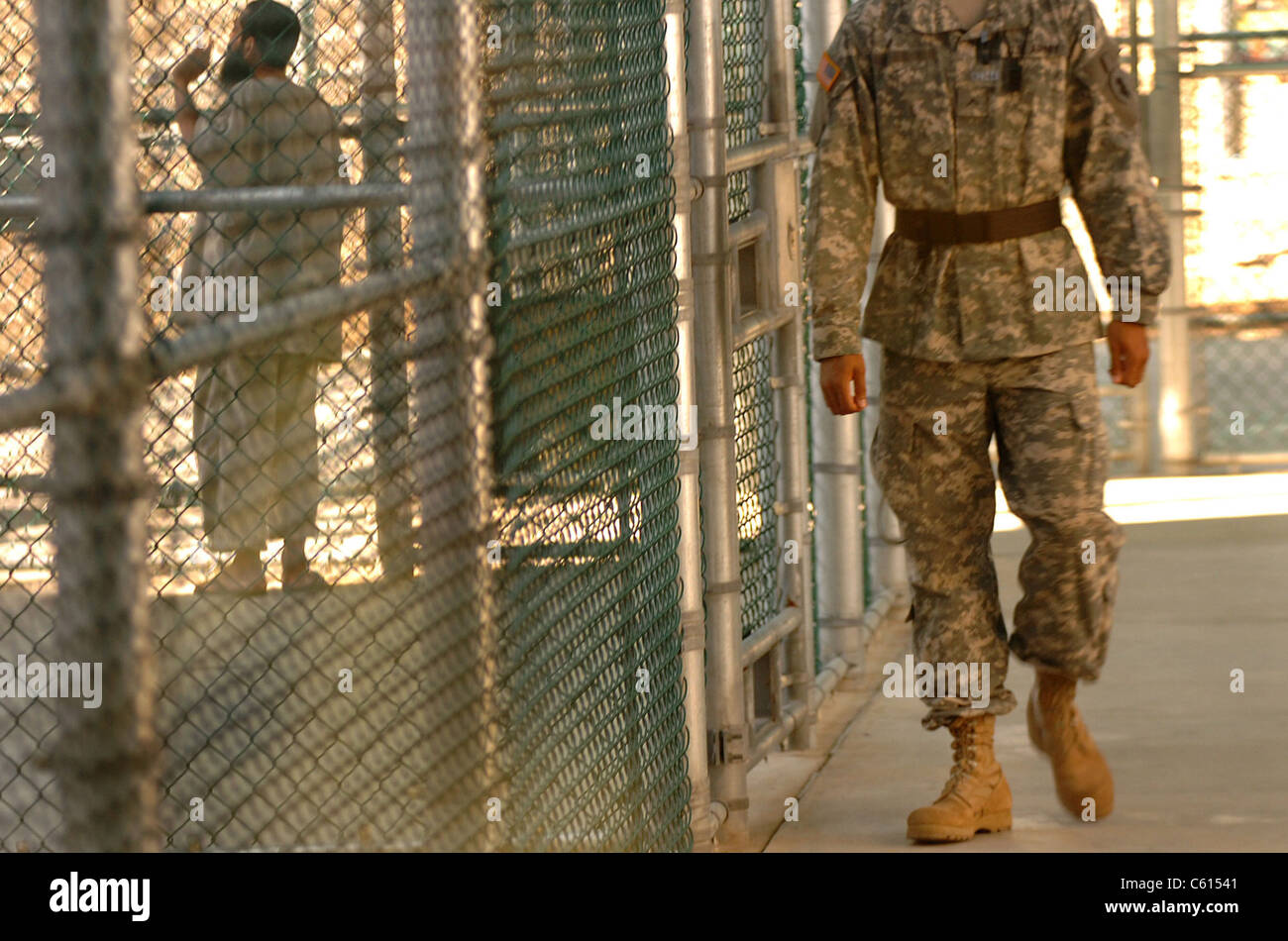 A U.S. Army Soldier stands guard as a detainee spends time in the ...