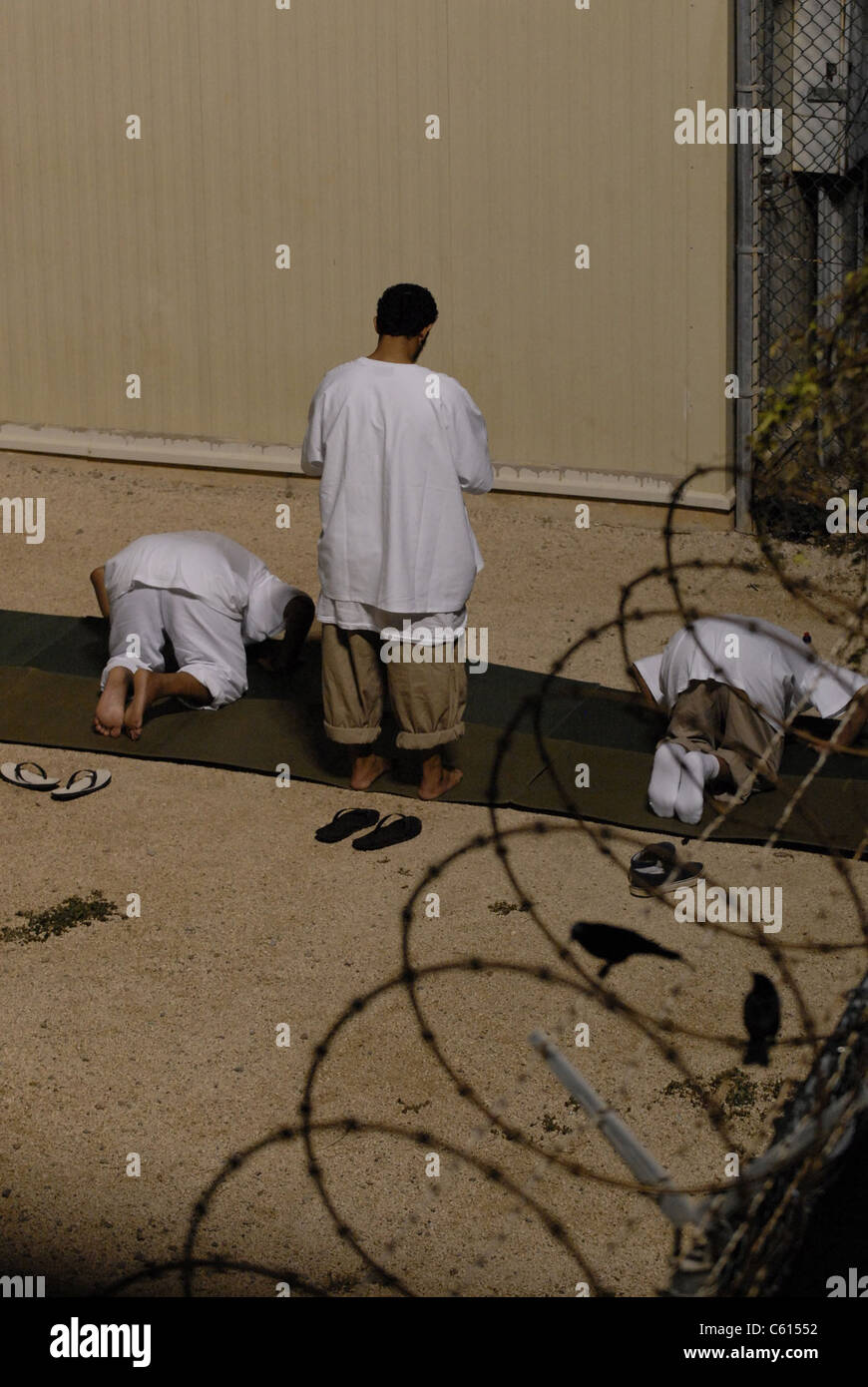 Islamic detainees pray at Camp Delta the military prison at Naval ...
