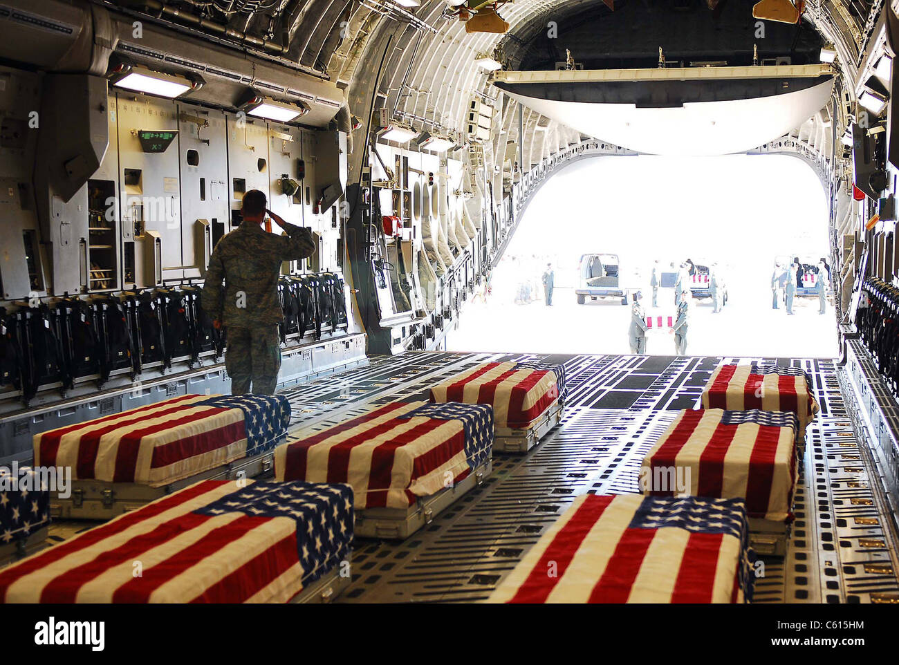 Flag draped coffins of five US soldiers killed at Fort Hood. 13 were ...
