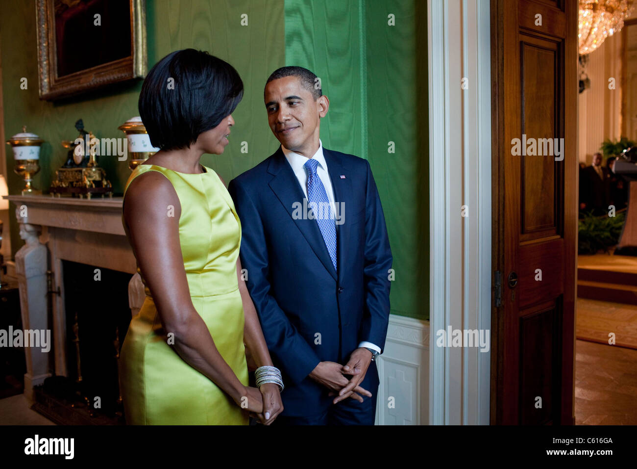 President and Michelle Obama wait in the Green Room before hosting a ...