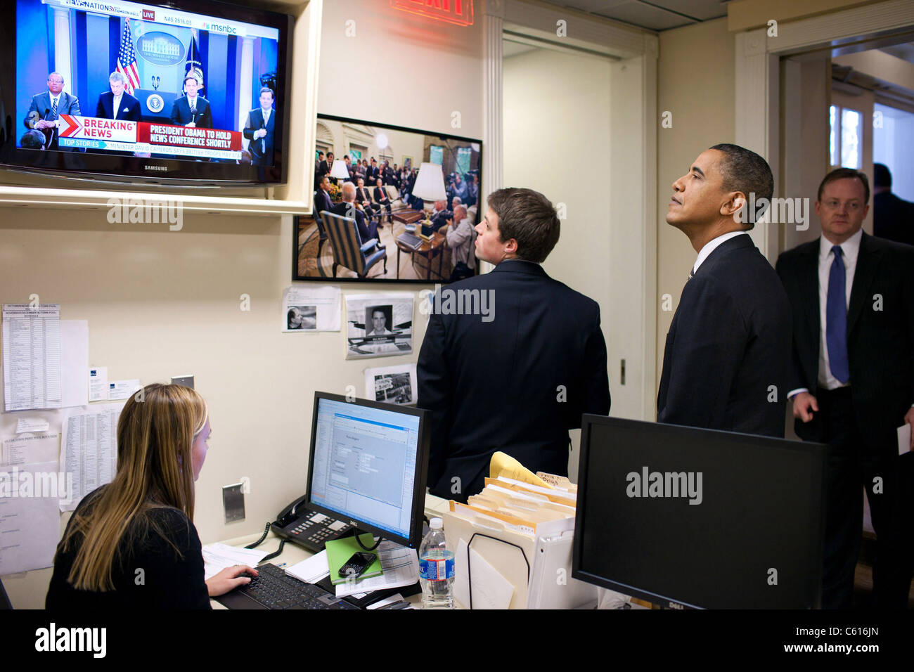 President Barack Obama watches MSNBC coverage of his News Conference as ...