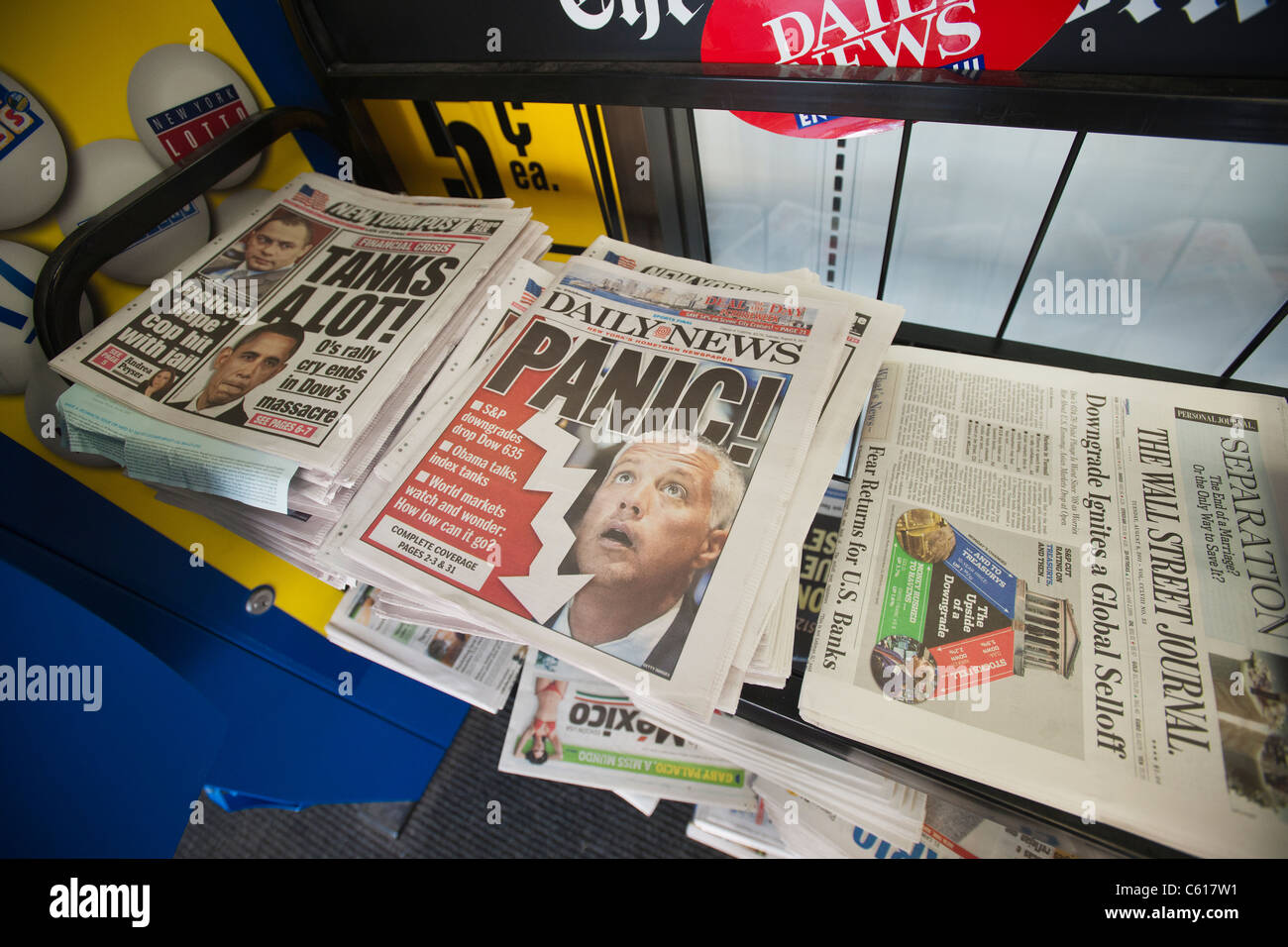 Newspaper headlines in NY on Tuesday, August 9, 2011 report on the ...