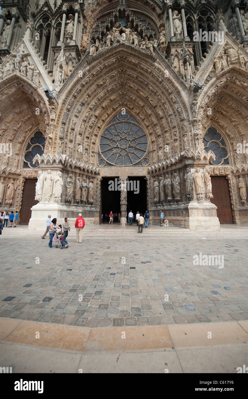 Newly renovated Reims Cathedral main entrance with tourists in northern ...