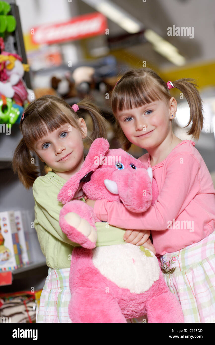 twins girls in the toy store Stock Photo - Alamy