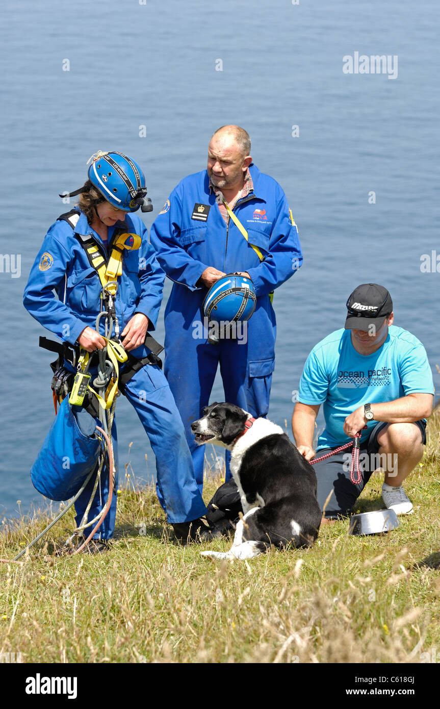 Members of the Pembrokeshire coast guard rescue a dog which had fallen ...