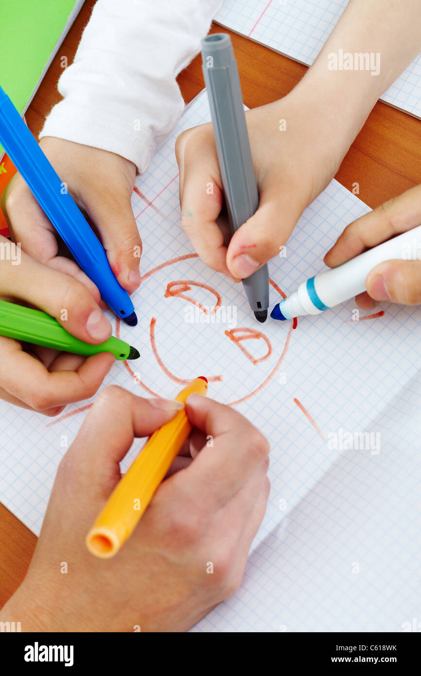 Close-up of human hands drawing with colorful highlighters Stock Photo ...