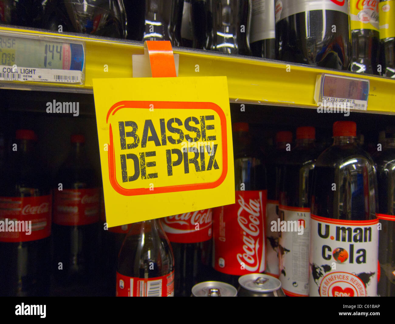 French Sign in Supermarket announcing Lower Prices on Soft Drinks ...