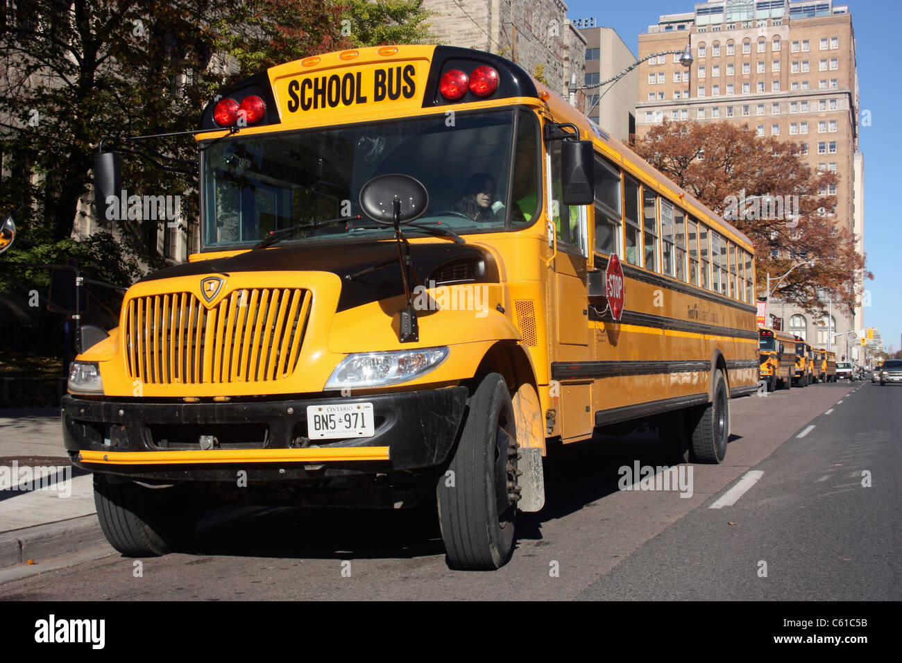 Canadian school bus waits outside university building Toronto Canada ...