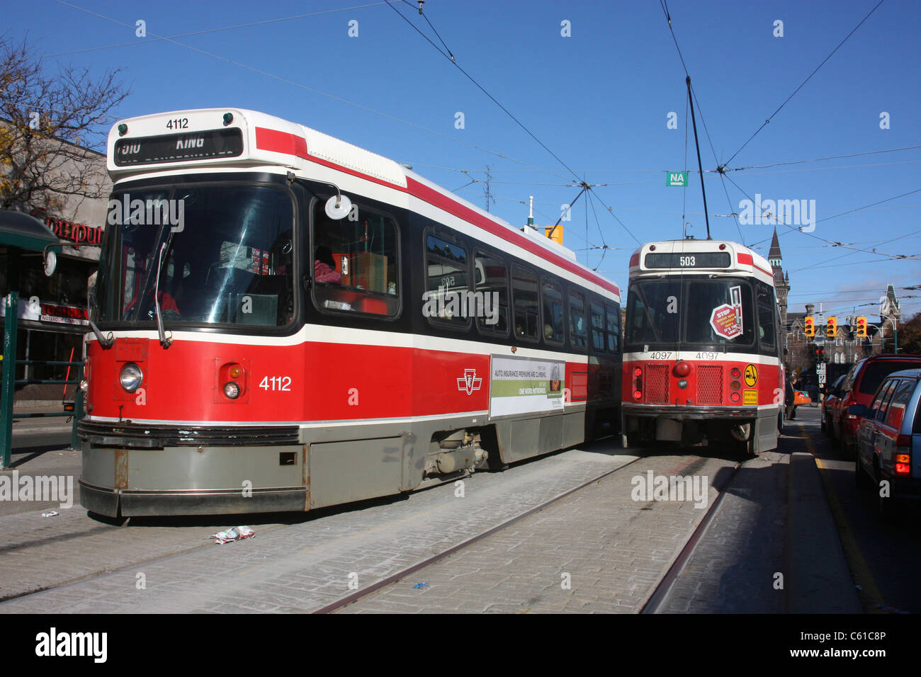 Tramcars of Toronto Transit Commission TTC crossing junction in a ...