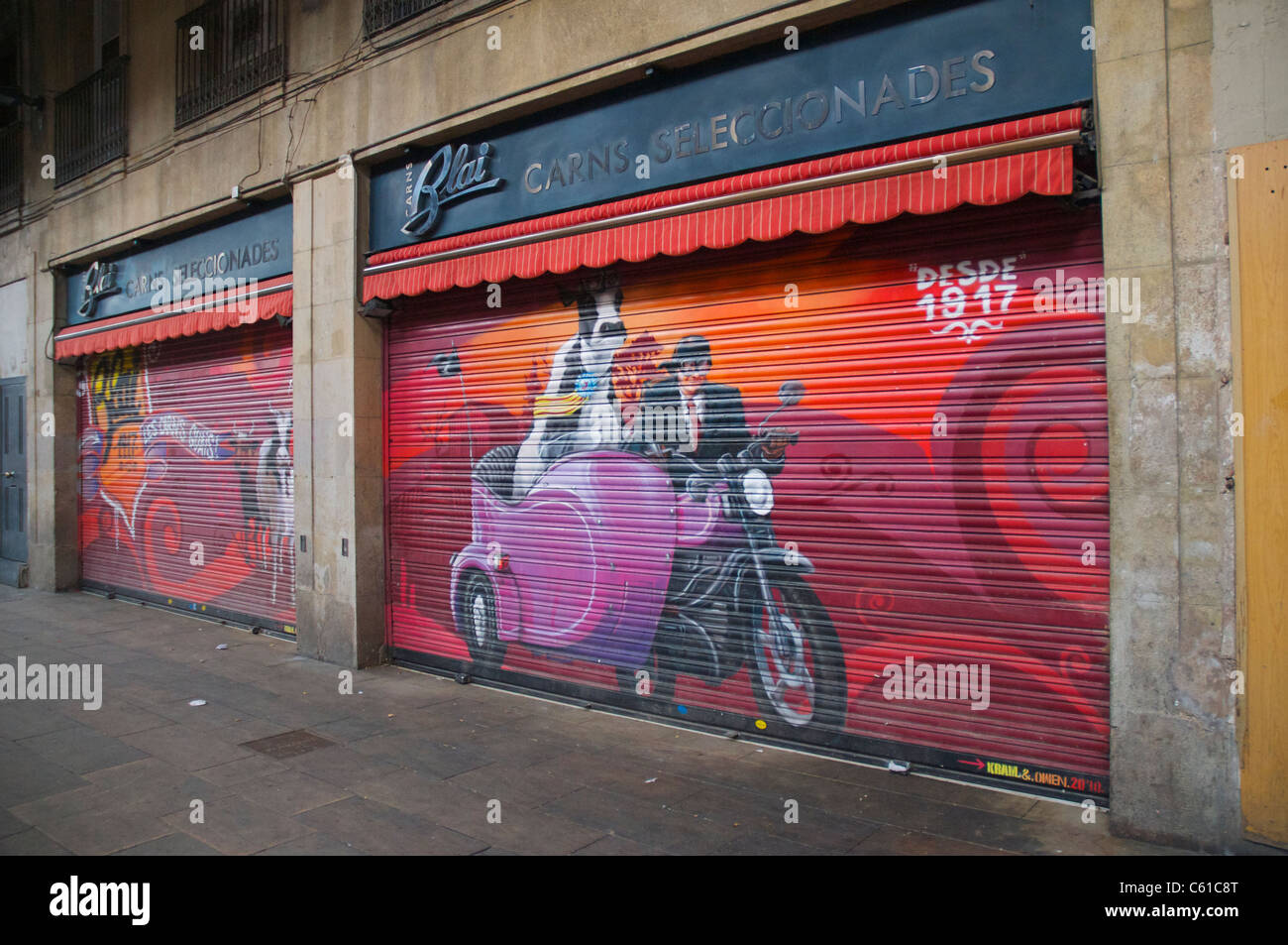 Decorative street art or graffiti on shop front at Mercat de la ...