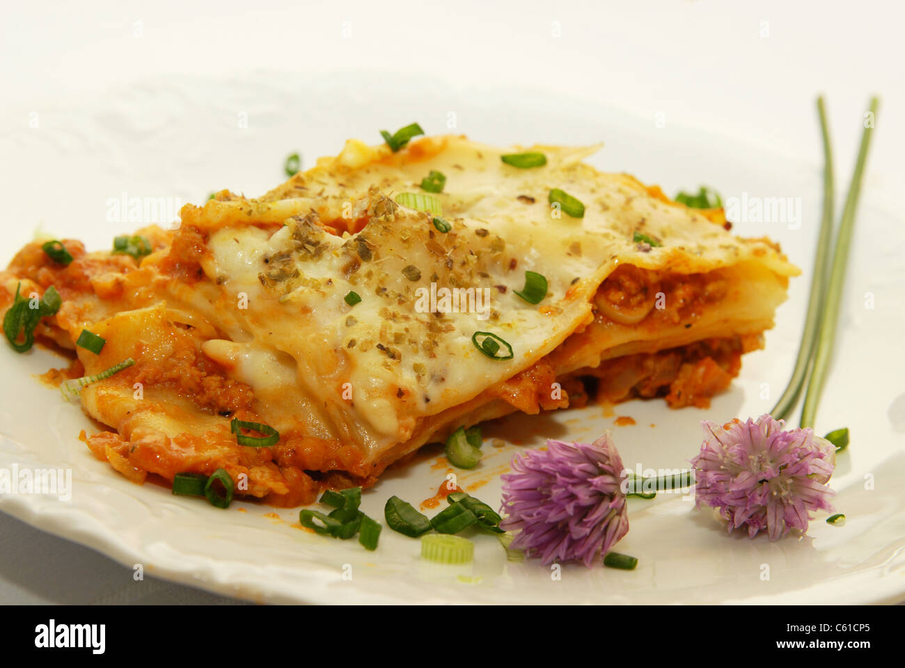 fresh lasagna with sauce Stock Photo - Alamy