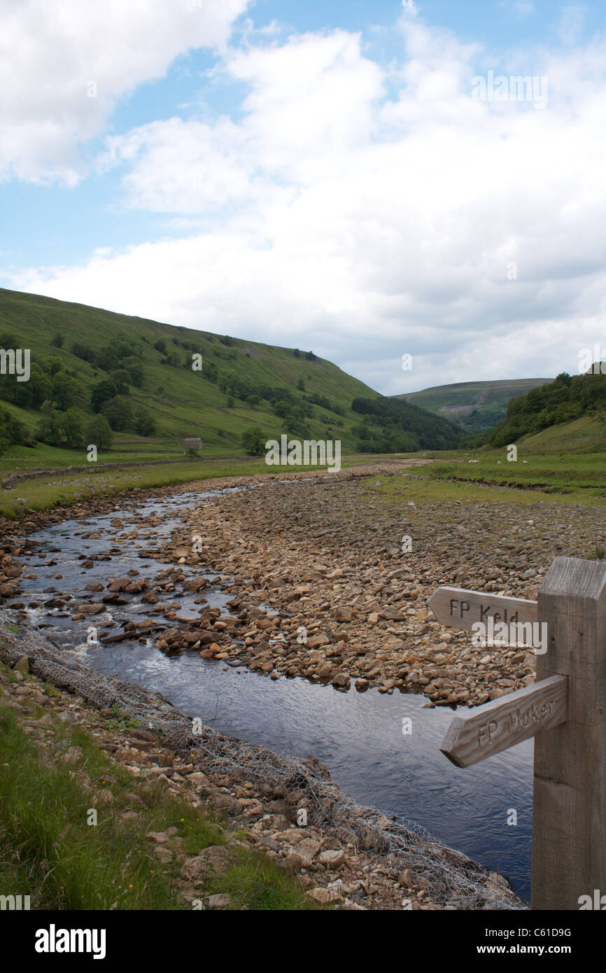 River Swale and public footpath signpost near Muker, Swaledale, North ...