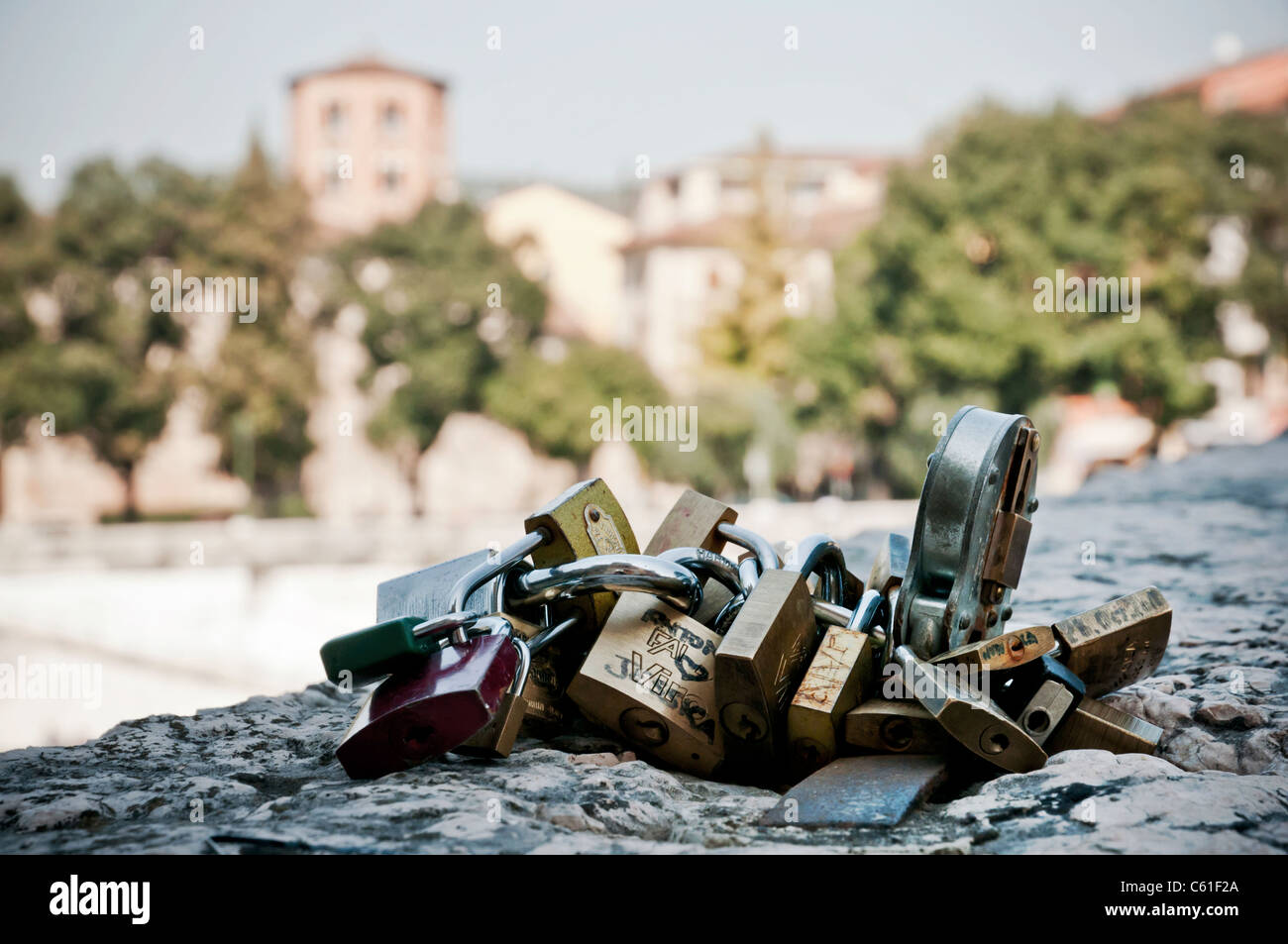 Love Padlocks tied to stone bridge, Verona Italy Stock Photo - Alamy