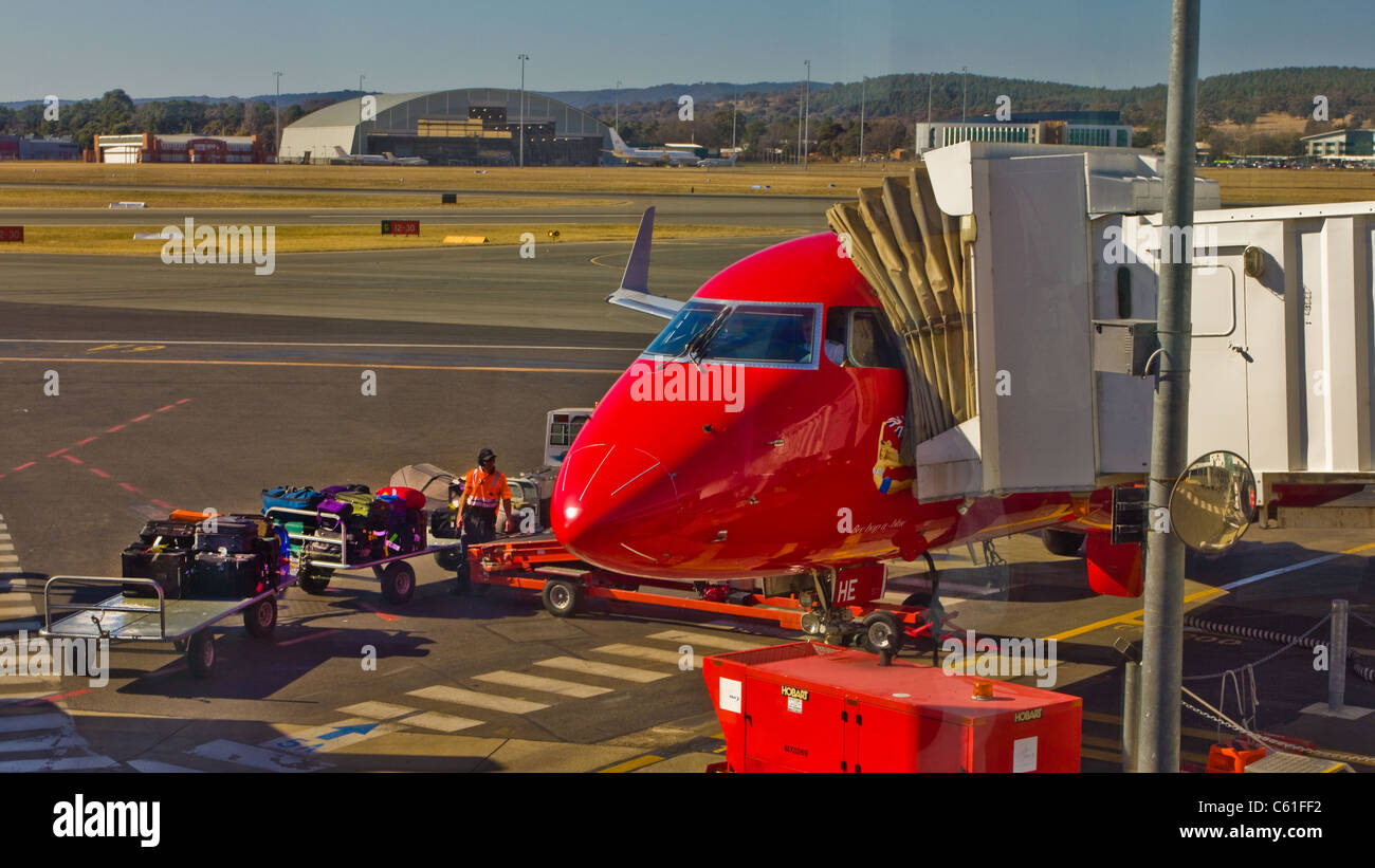 Virgin Blue Boeing 737-800 aircraft at terminal loading baggage Stock ...