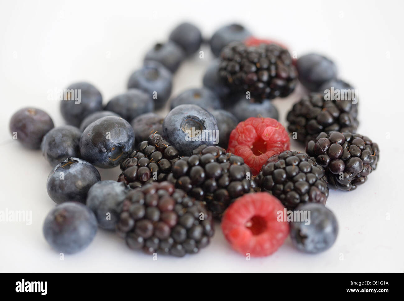 Blueberry, blackberry and raspberry on the white background Stock Photo ...
