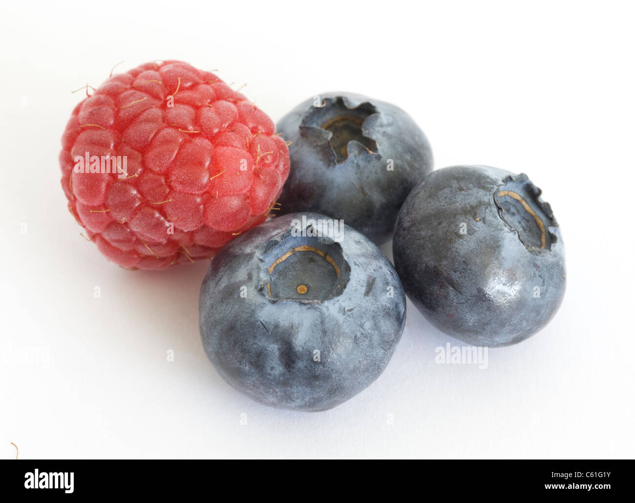 Blueberry and raspberry on the white background Stock Photo - Alamy