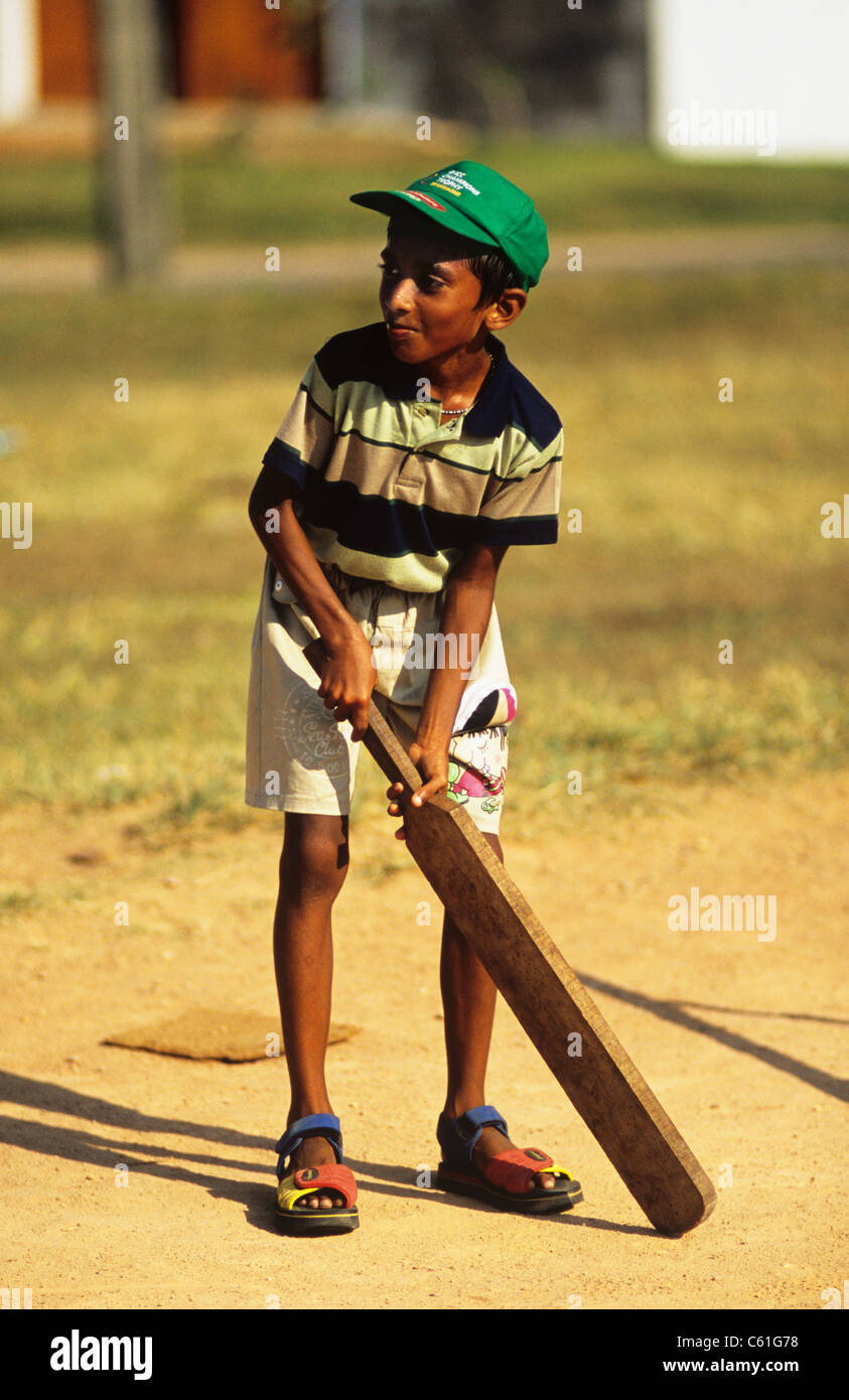 Young boy playing cricket. Galle, Sri Lanka Stock Photo - Alamy