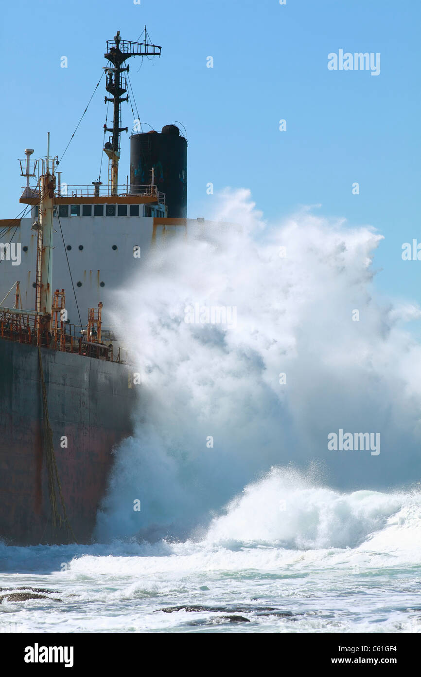 Waves pound the 164 metre bulk tanker, Phoenix, aground on a rocky ...