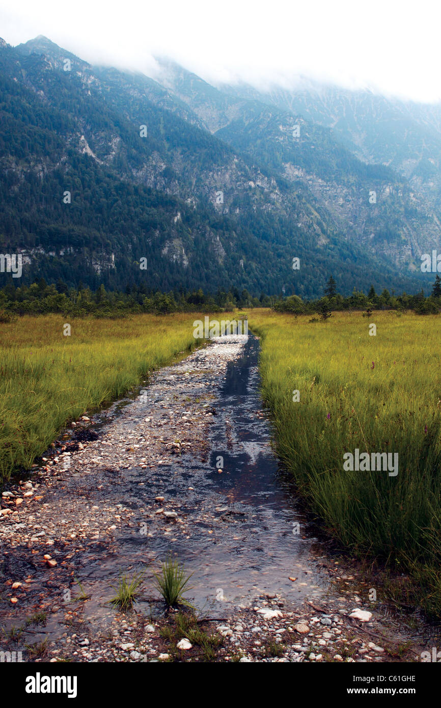 old destroyed road to mountains covered with fog Stock Photo - Alamy
