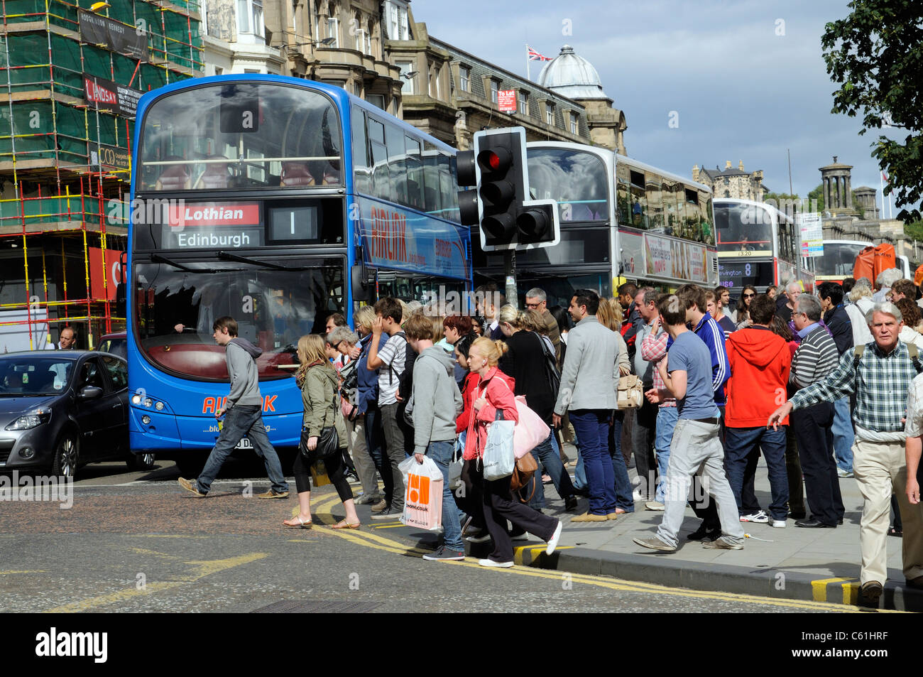 Princes Street Edinburgh Scotland buses and people crowd the pavement ...