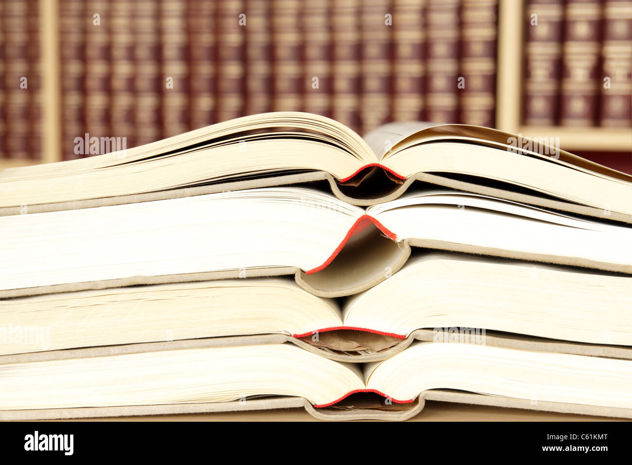 Open books in the library Stock Photo - Alamy