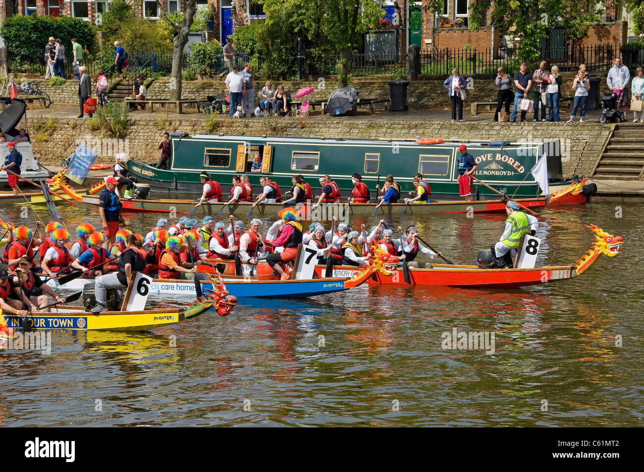People in fancy dress on boats in Dragon Boat Challenge charity race in ...