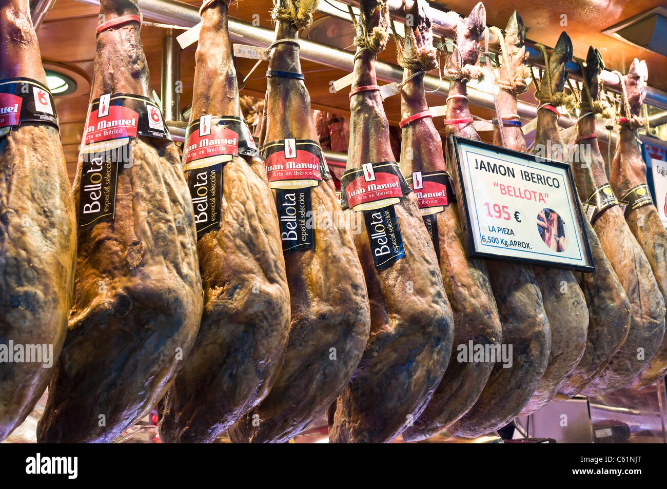 Iberico ham display at La Boqueria, Barcelona, Spain Stock Photo - Alamy