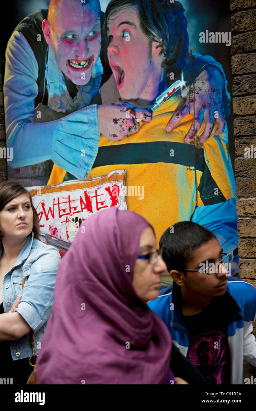Tourists queue up outside the London Dungeons. The London Dungeon is a ...