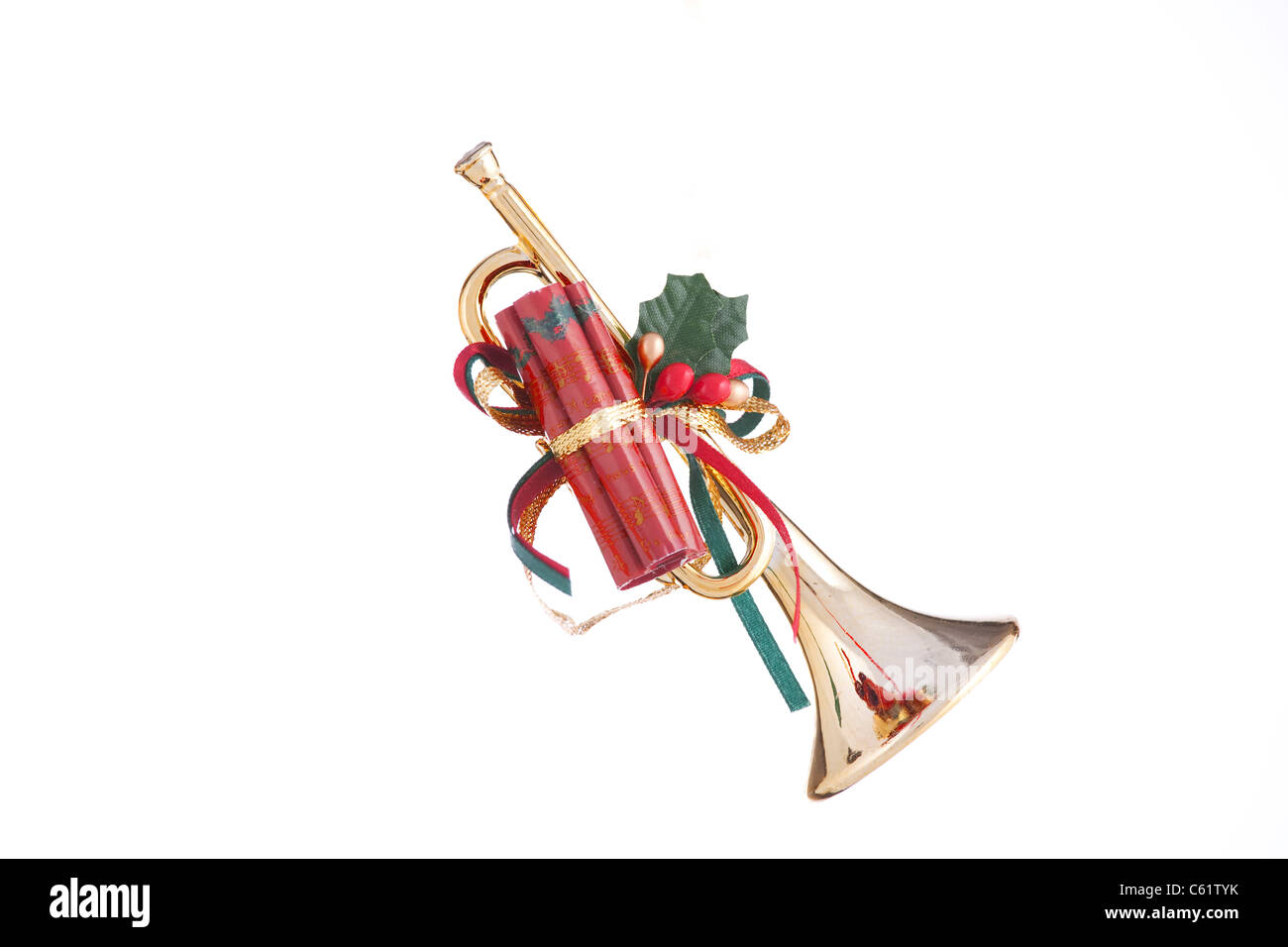 A gold Christmas tree horn ornament isolated against a white background ...