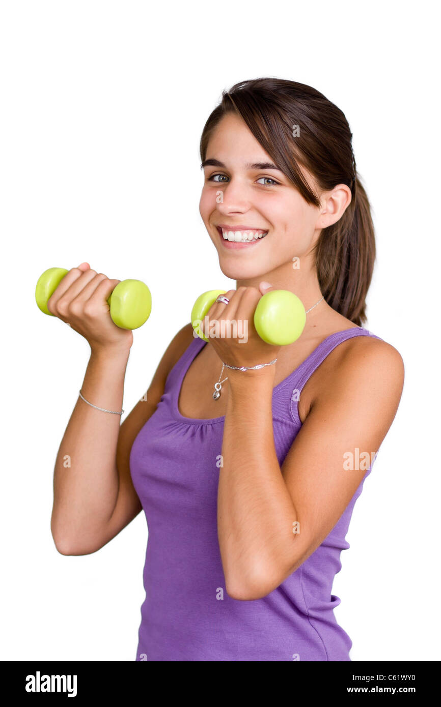 Pretty young woman lifting dumbbells Stock Photo - Alamy