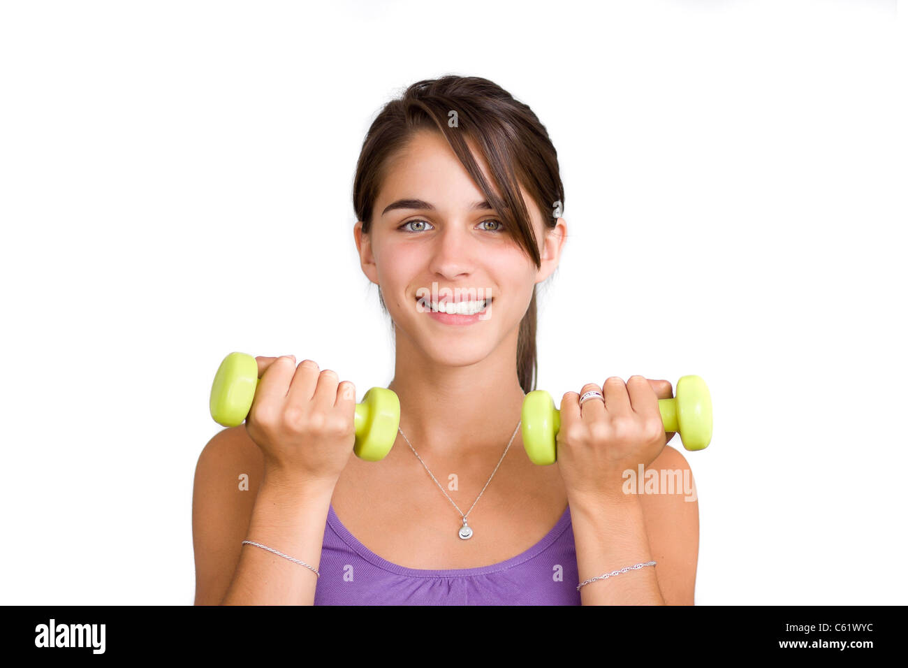 Pretty young woman lifting dumbbells Stock Photo - Alamy