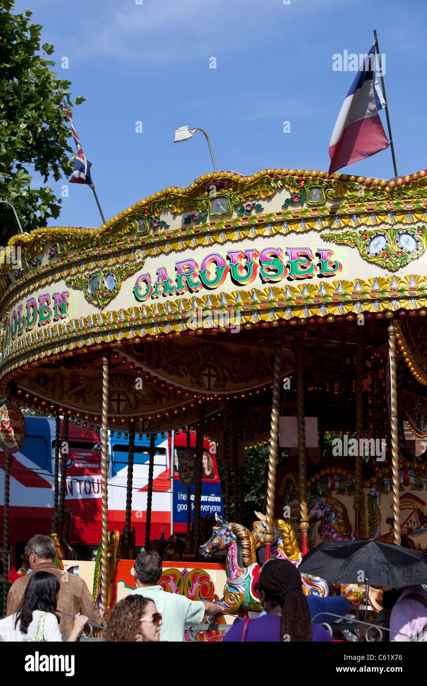 British merry go round carousel ride Stock Photo - Alamy
