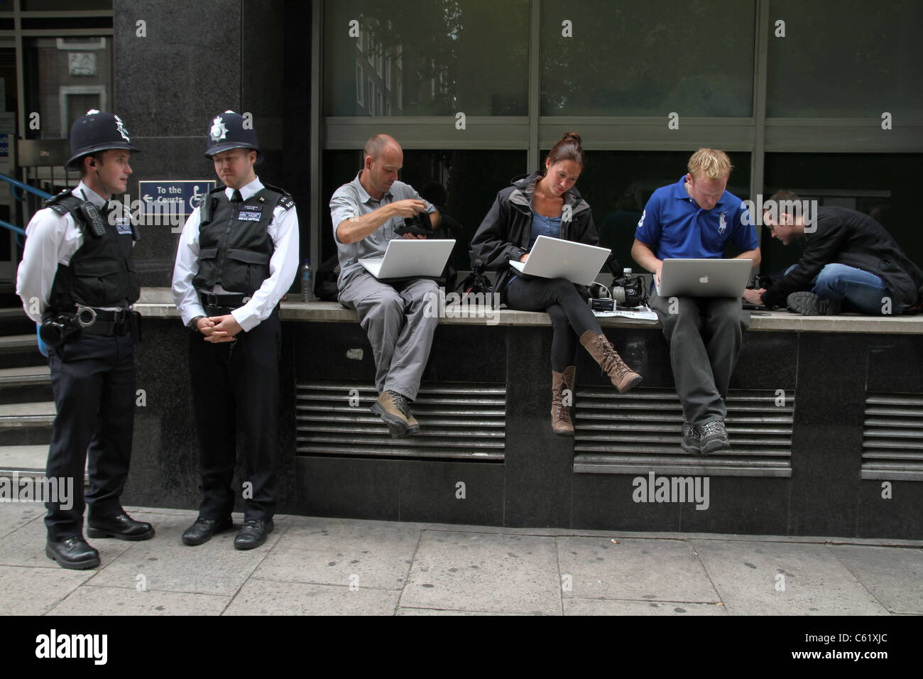 Police and journalists outside Westminster Magistrates Court after the ...
