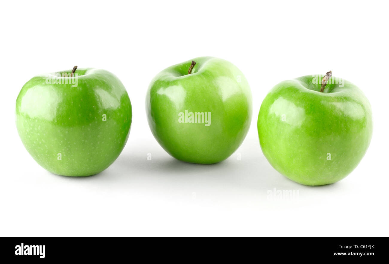 three green apples isolated on white background Stock Photo - Alamy