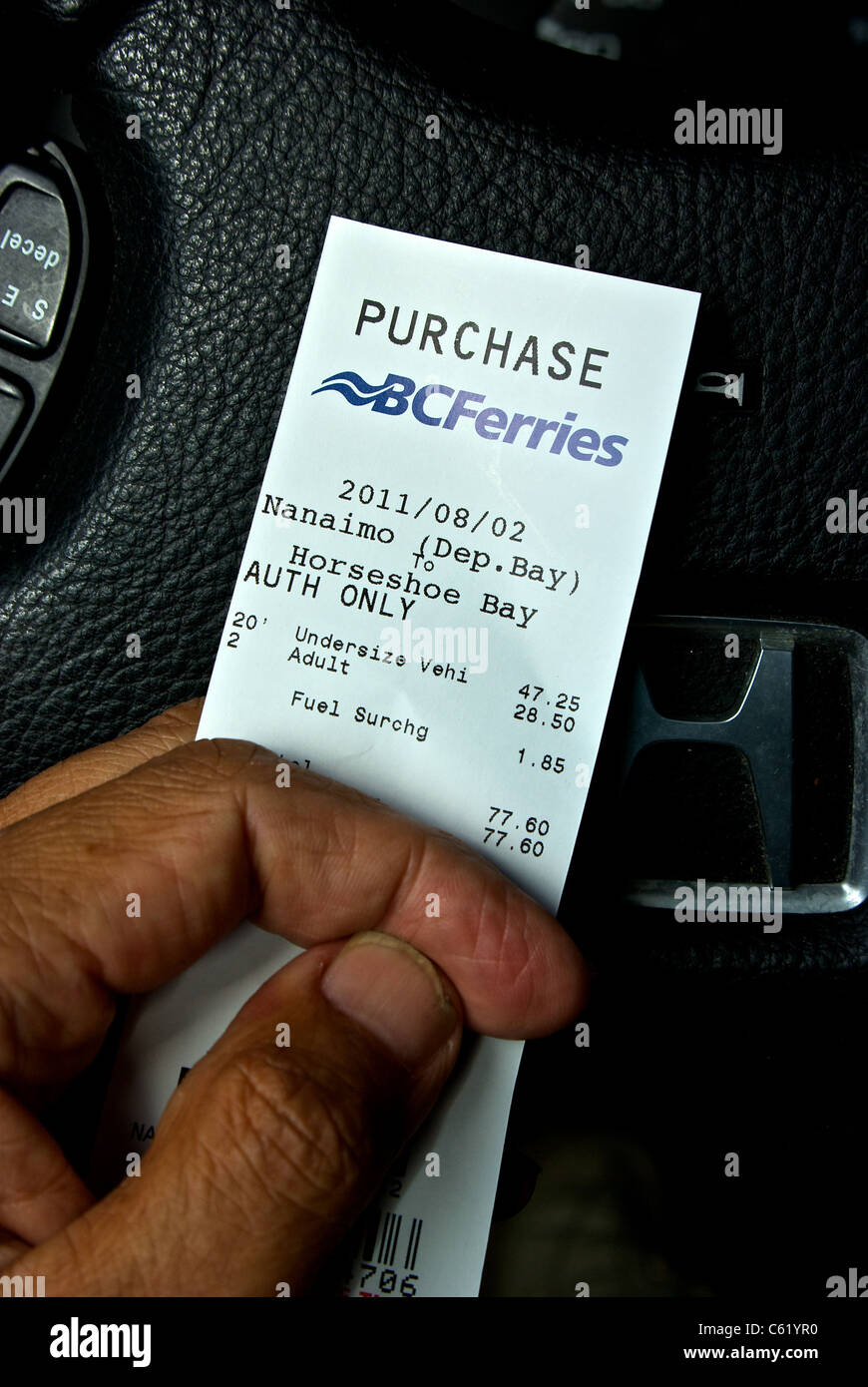 Hand holding BCFerries car passenger ticket for ferry crossing from ...