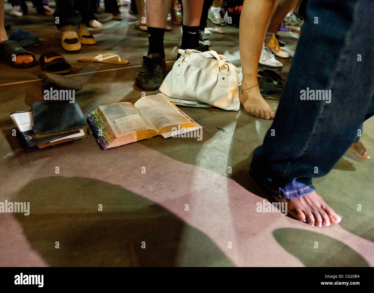 Christian religious faithful dance and sing during worship with an open ...