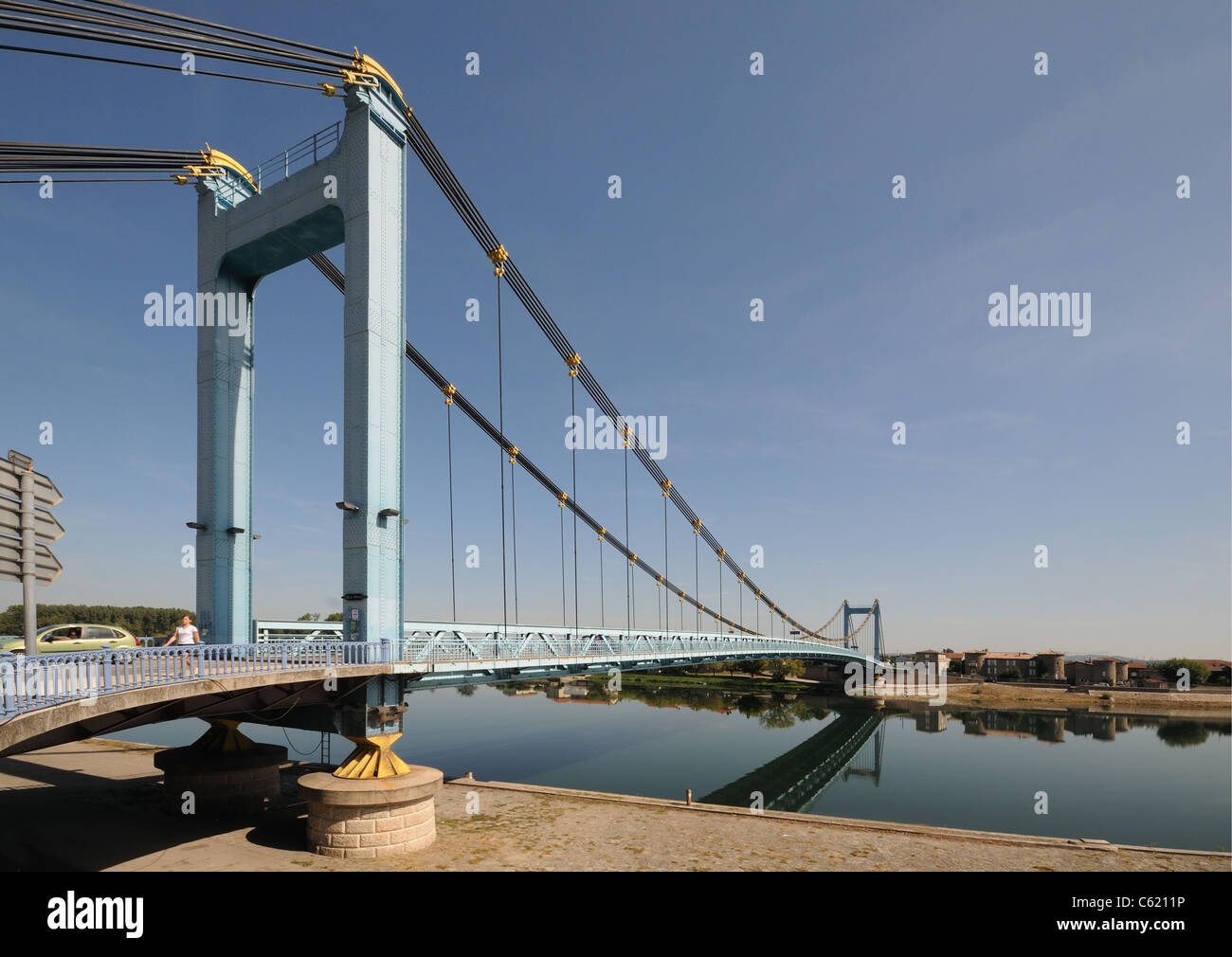 Suspension road bridge over river Rhone between Serrieres and Sablons ...